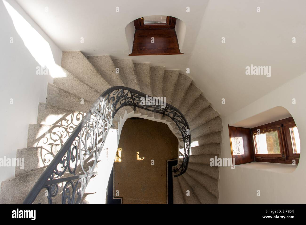 Staircase in tower with windows Stock Photo - Alamy