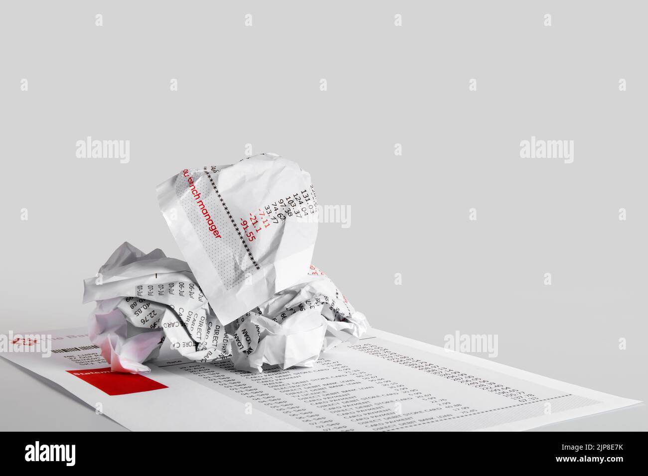Scrunched up Bank Statement showing account in debt Stock Photo - Alamy