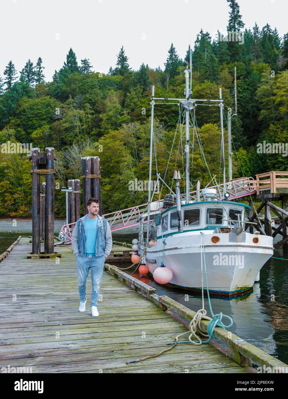Vancouver Island, Canada, Quadra Island old harbor with a fishing boat ...