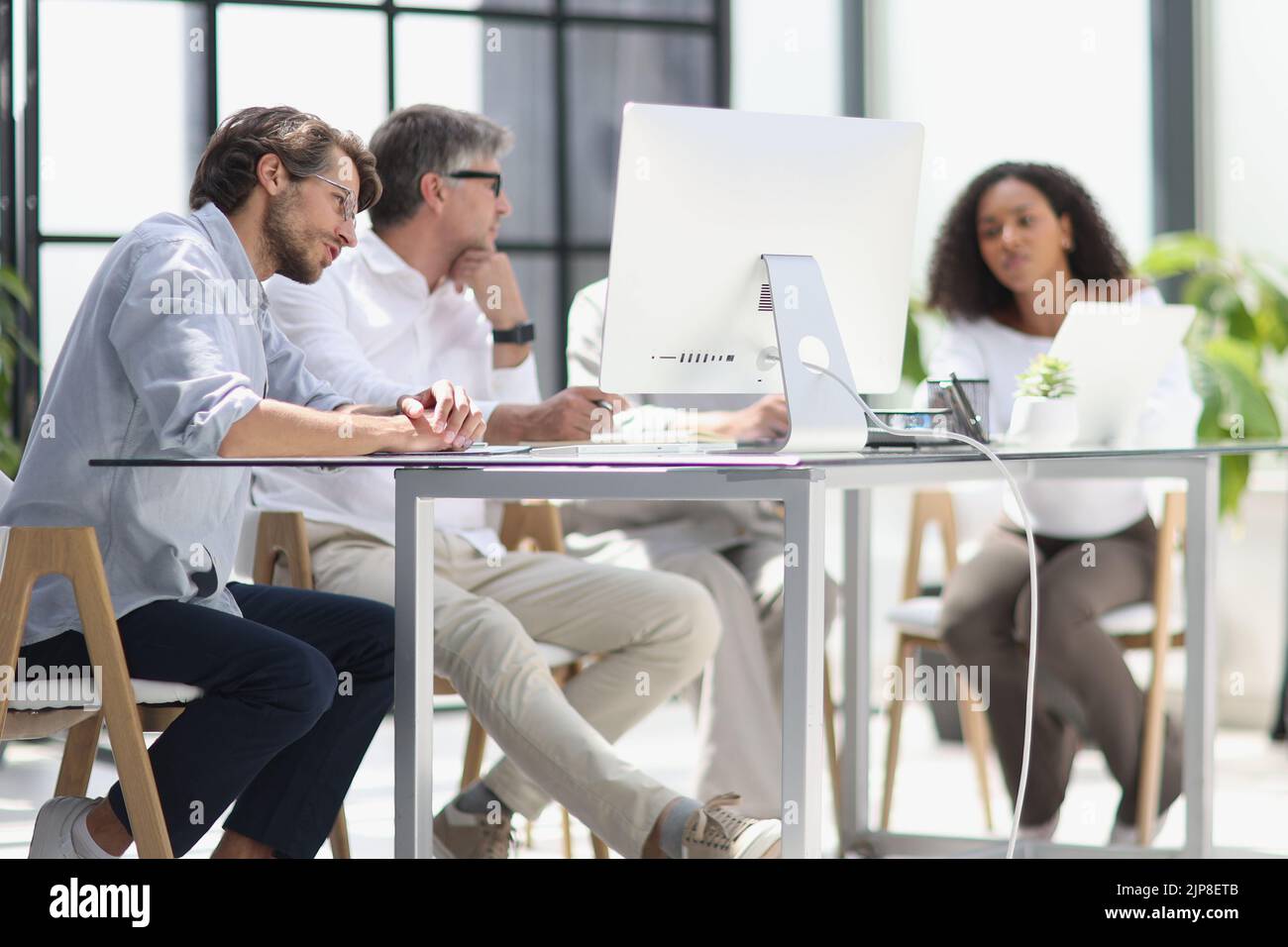 Conversation between managers and employees in the office Stock Photo ...
