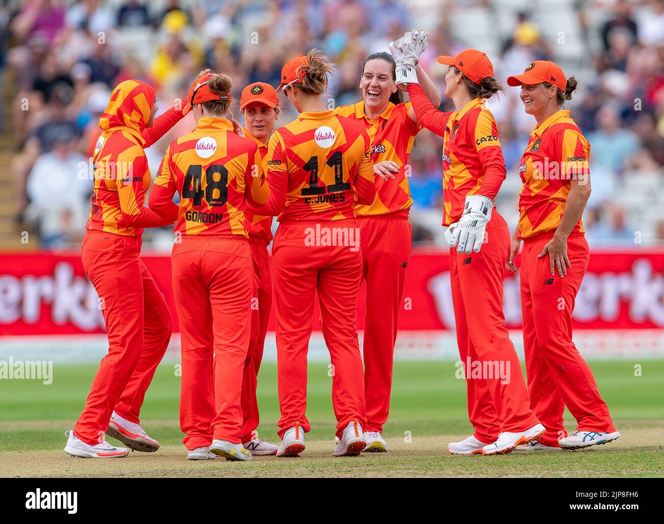 Emily Arlott (3rd right)) smiles as she takes a wicket for Birmingham ...