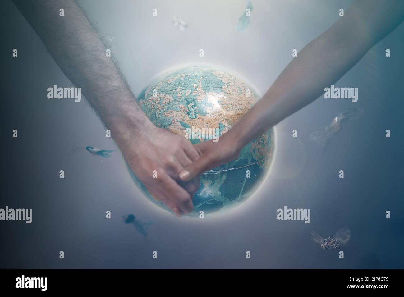 Different races holding hands hi-res stock photography and images - Alamy