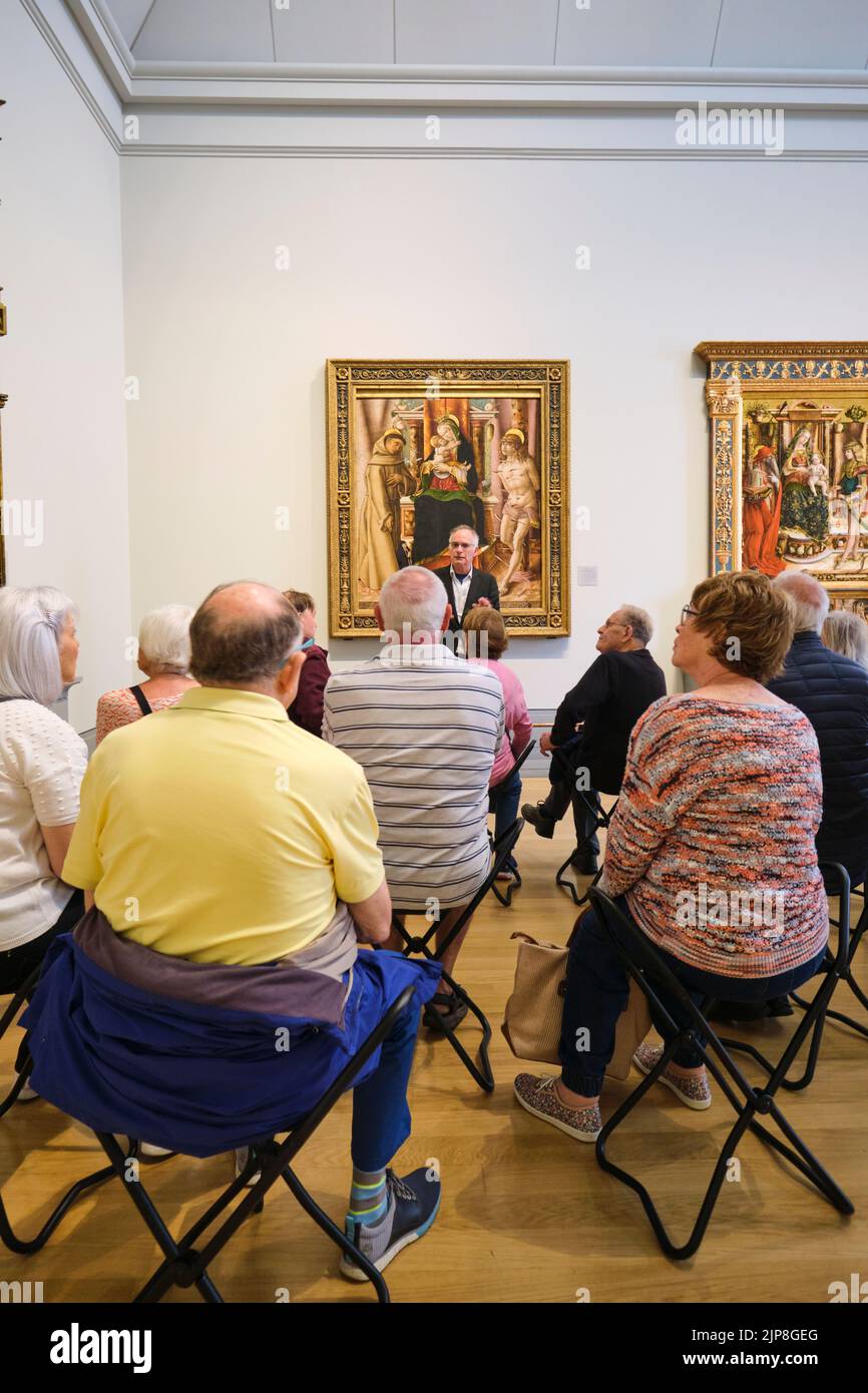 A docent teaches a group of students about a specific Old Master ...