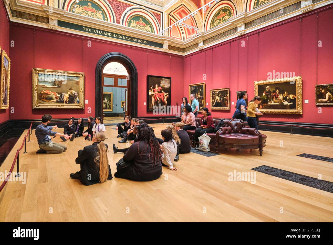 A docent teaches a group of students about a specific Old Master ...