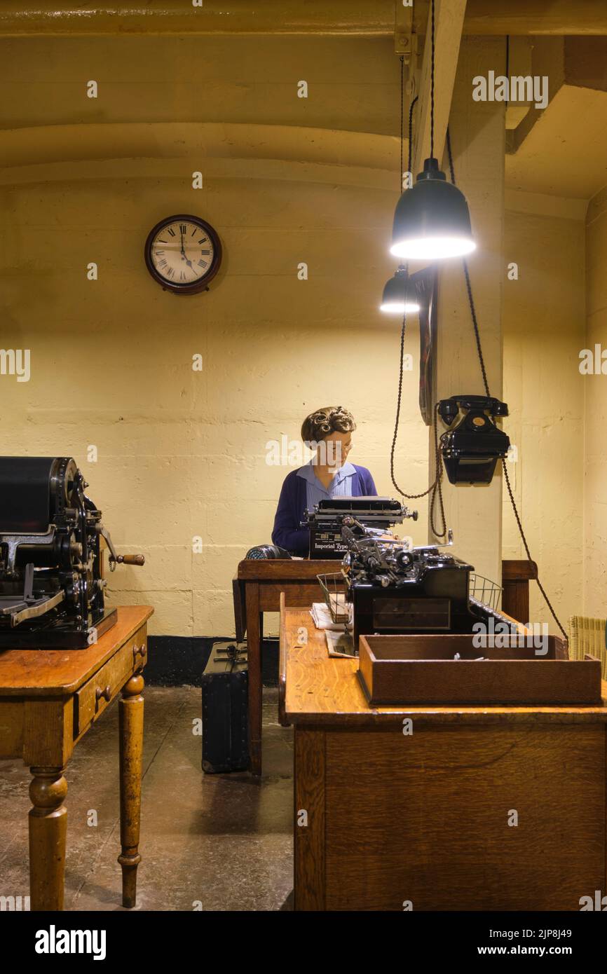 A woman busy typing in the typing pool area, room. At the Winston ...