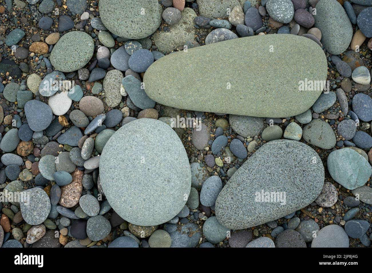 Pebble beach stones background, natural rounded gravel on the seashore ...