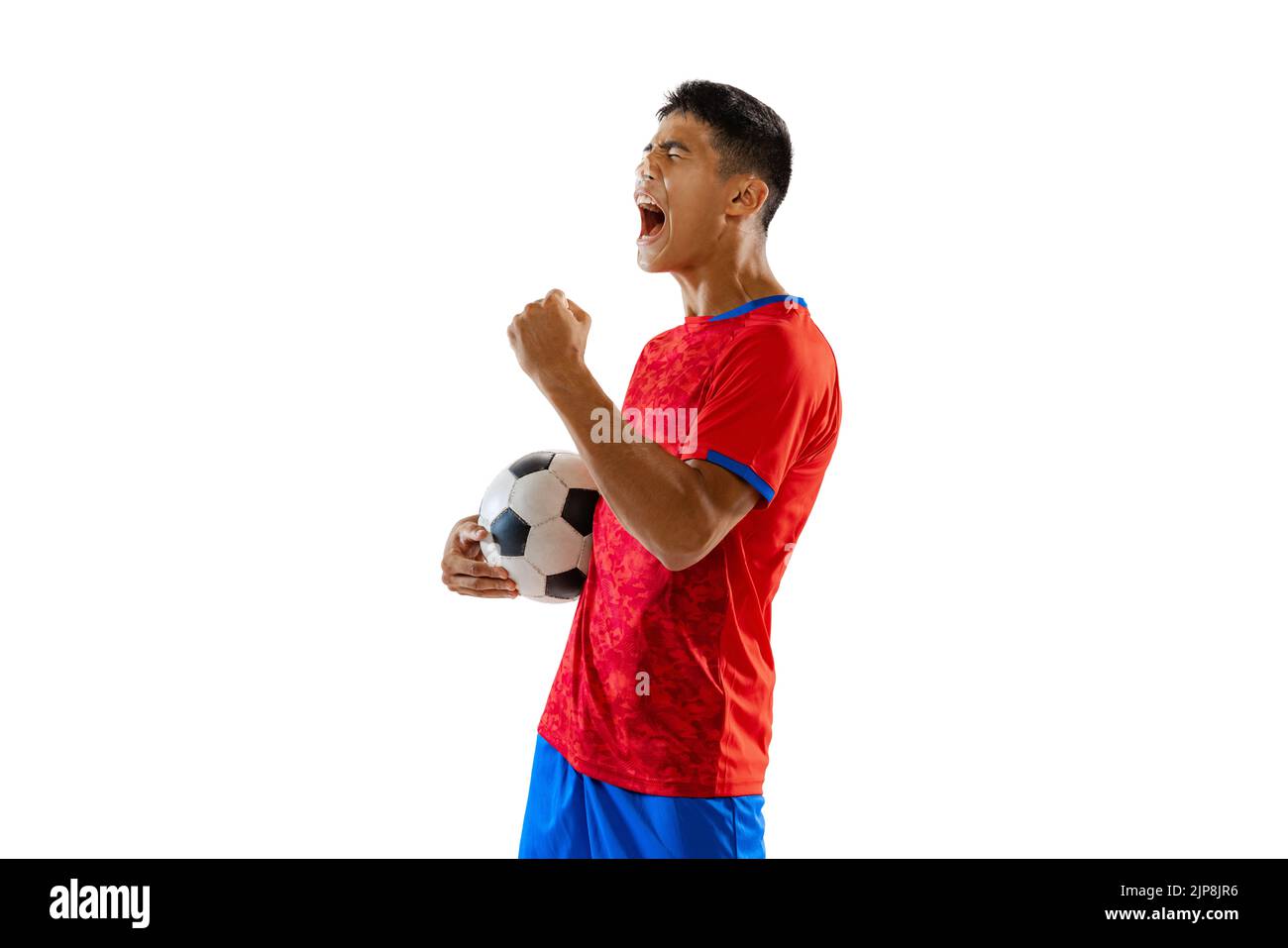 Portrait of young emotive man, motivated football player in uniform ...