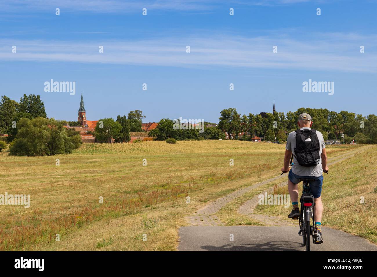 Tourist cycling along the green belt near Domitz former inner-German ...
