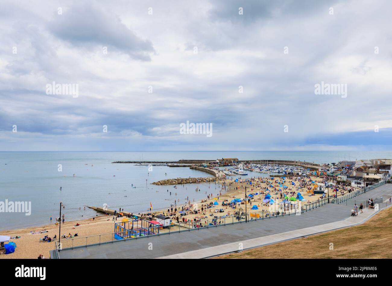 View of the Cobb, shoreline and beach at Lyme Regis, a popular seaside ...