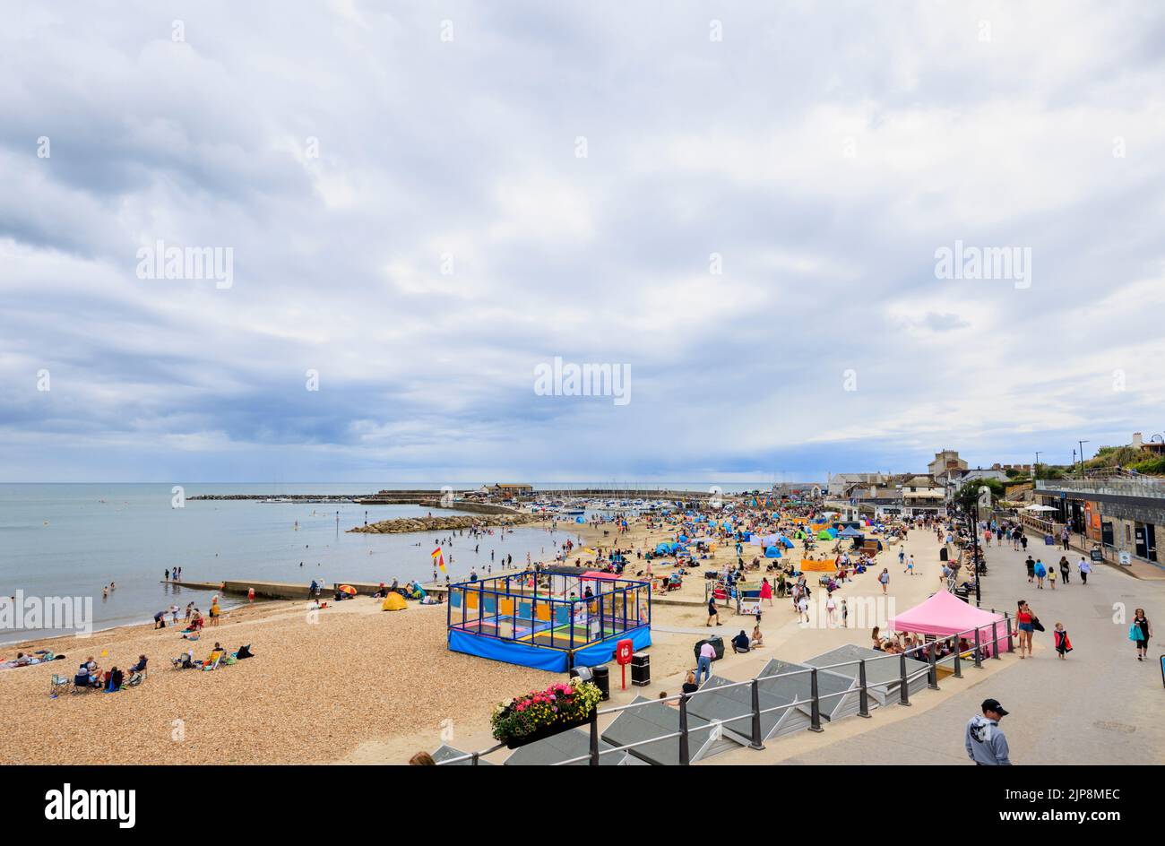 View of the Cobb, shoreline and beach at Lyme Regis, a popular seaside ...