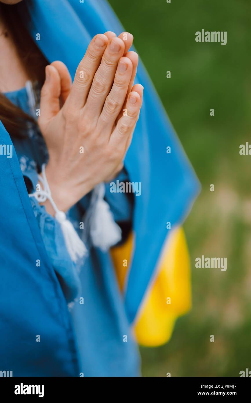 Pray for Ukraine, stand with. Ukrainian woman with national flag. Young ...