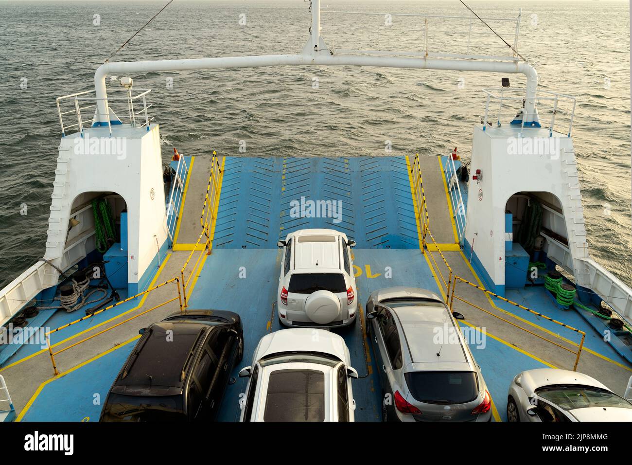 Feriyboat cruising on the sea with cars, upper view Stock Photo - Alamy