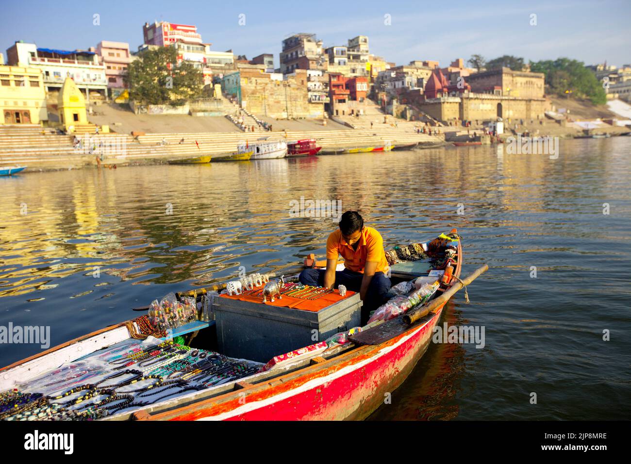 Handicraft vendor in boat, Ganga river Ganges, Varanasi, Banaras ...