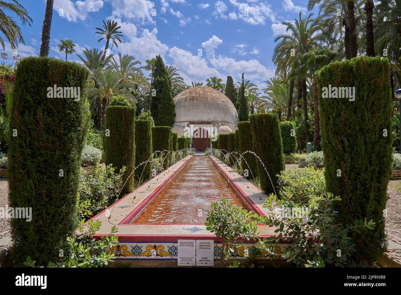 Fountain inside of the Elche Palmeral. In the municipal park in Elche ...