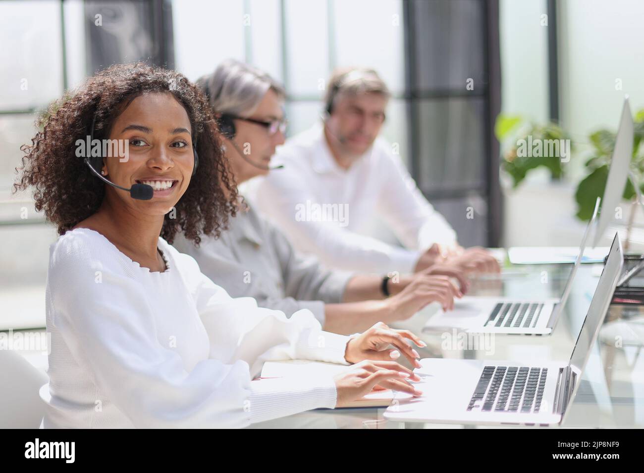 african american operator smiling in a call center Stock Photo - Alamy