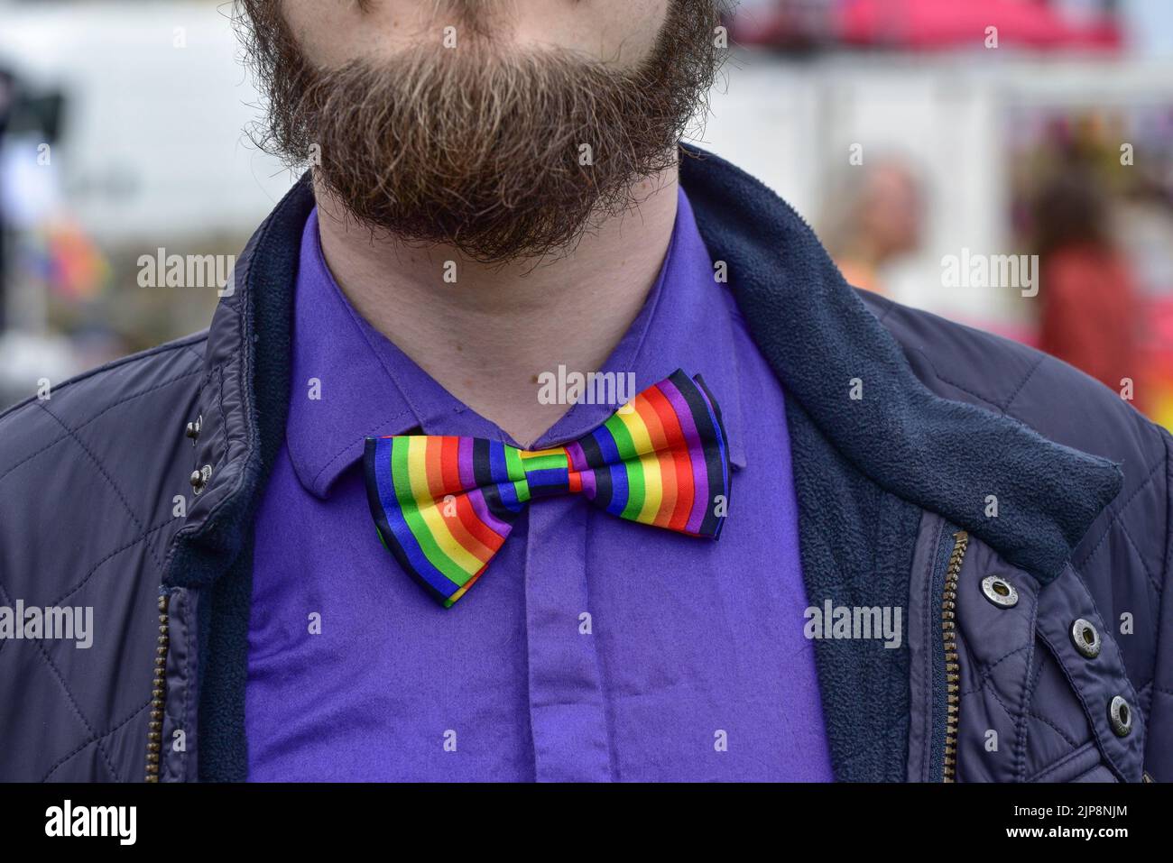 A participant wearing a colourful bow tie in the Cornwall Prides Pride ...