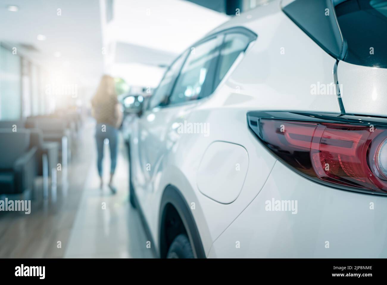 Closeup tail light of white SUV car parked in luxury showroom. Car ...