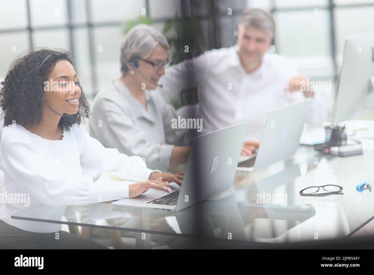 Working at the help desk hi-res stock photography and images - Alamy
