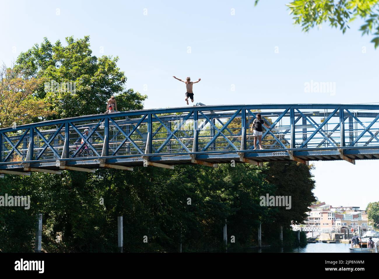 Man Jumping From Bridge Stock Photo - Alamy