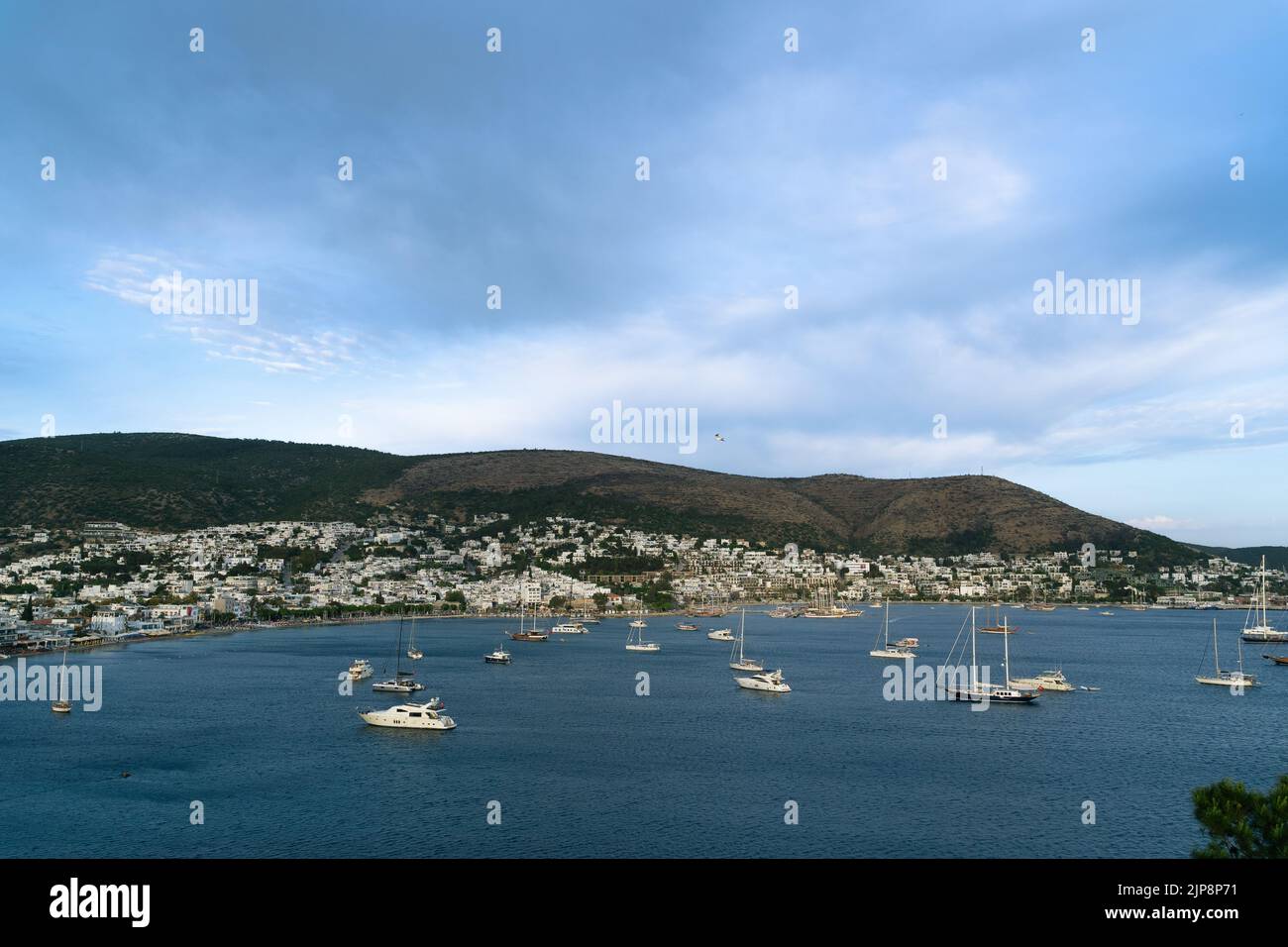Bodrum view from afar, with ships at sea. Famous holiday village at ...