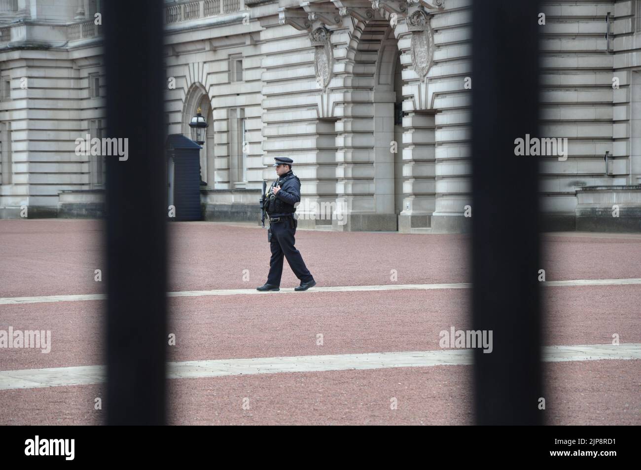 A closeup shot of security at Buckingham Palace from bars Stock Photo ...