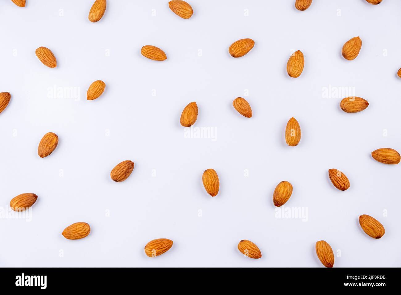 background nuts almonds on a yellow background, the concept of healthy ...