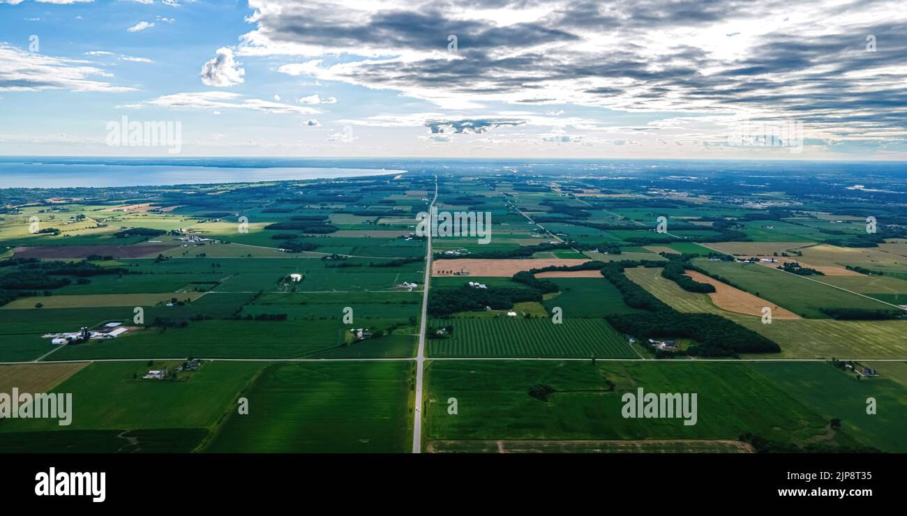 Summer day in rural portion of wisconsin with farmland and lake ...