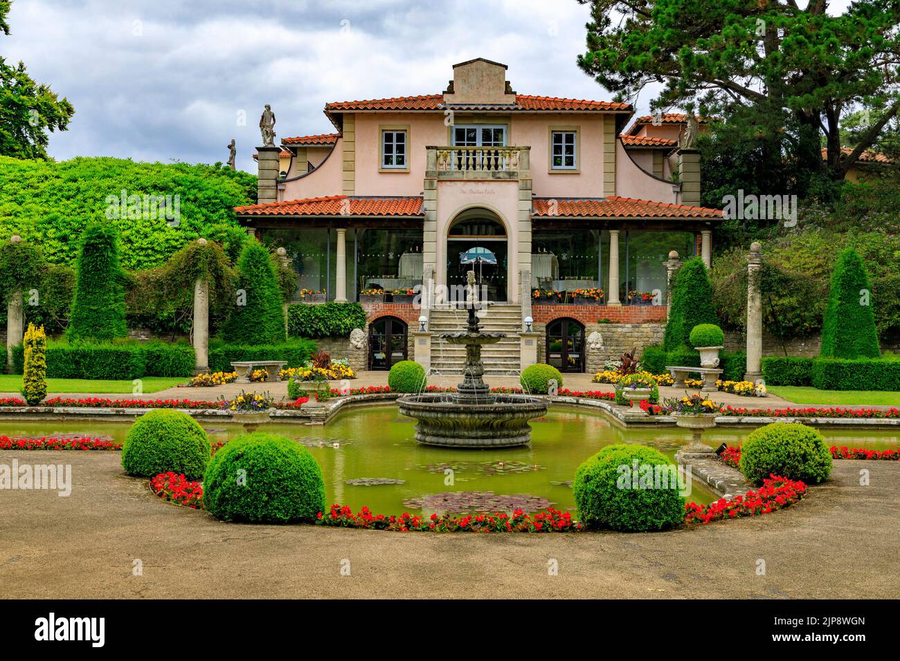 Colourful planting in front of the Italian Villa façade in the Italian ...