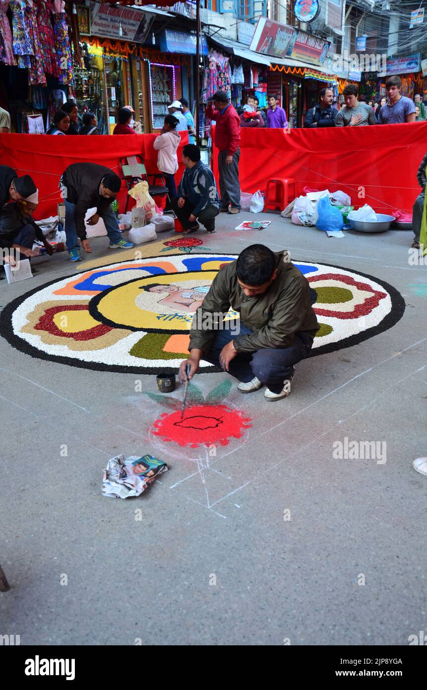 Nepalese drawing made rangoli symbol from powder or sand paint color ...