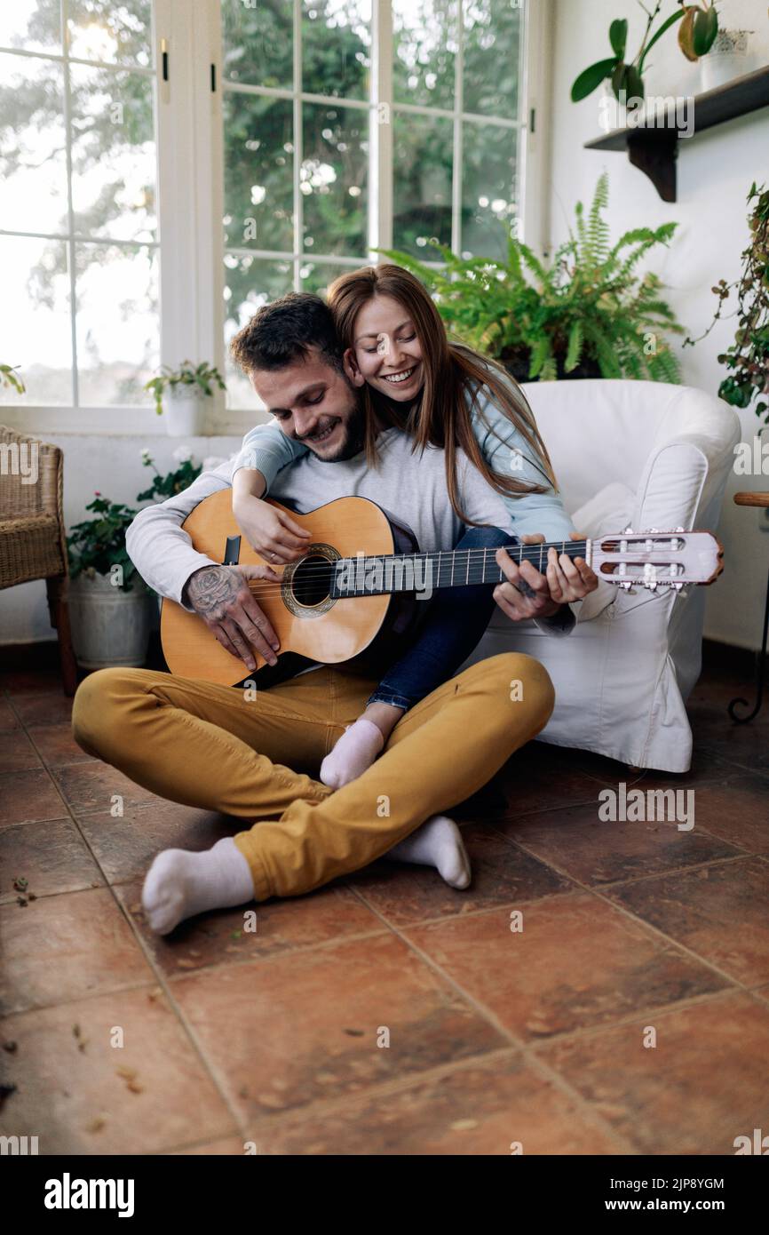 couple, embracing, home, playing guitar, pairs, cuddling, hug, hugging, homes, playing guitars ...