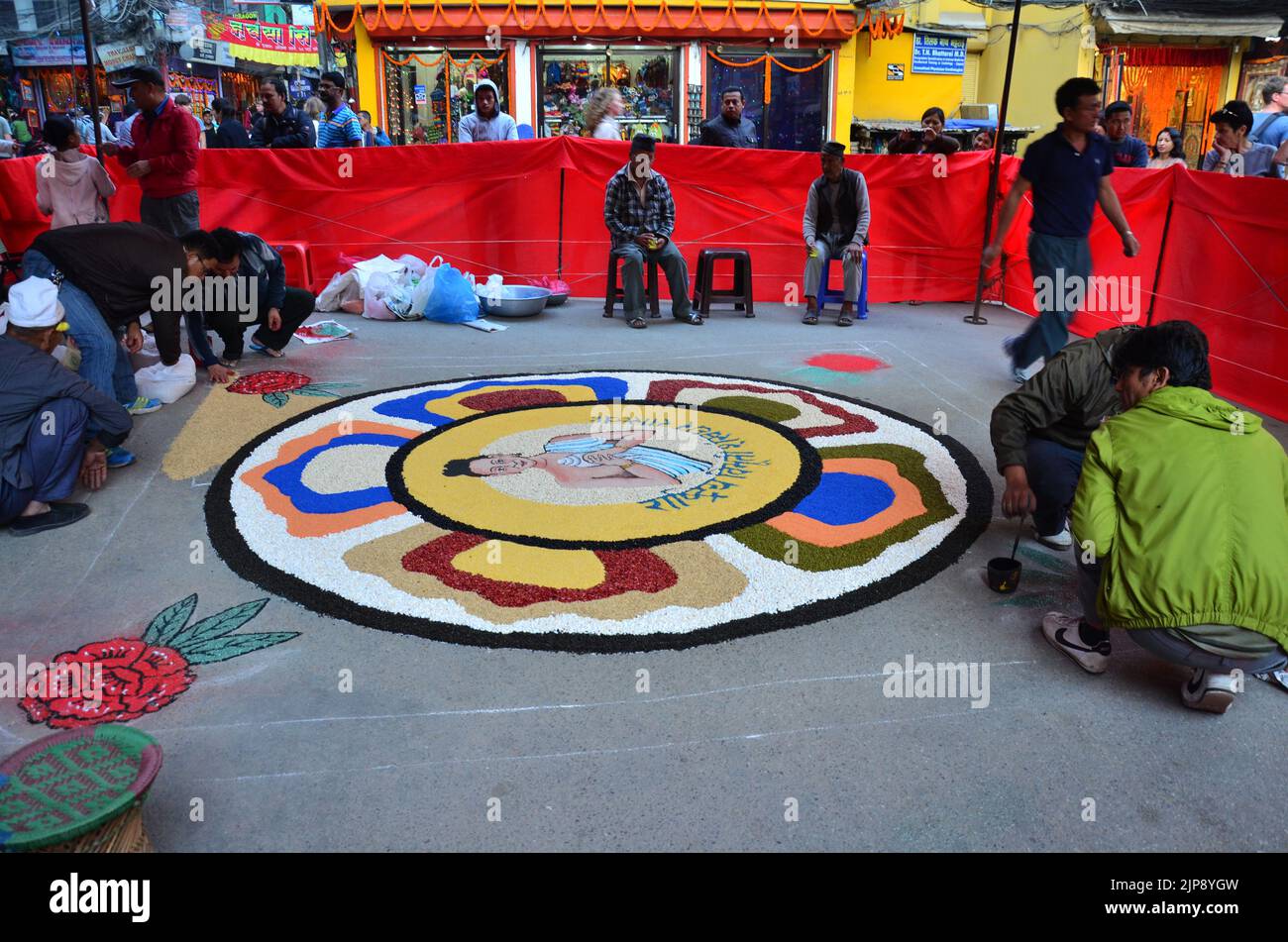 Nepalese drawing made rangoli symbol from powder or sand paint color ...