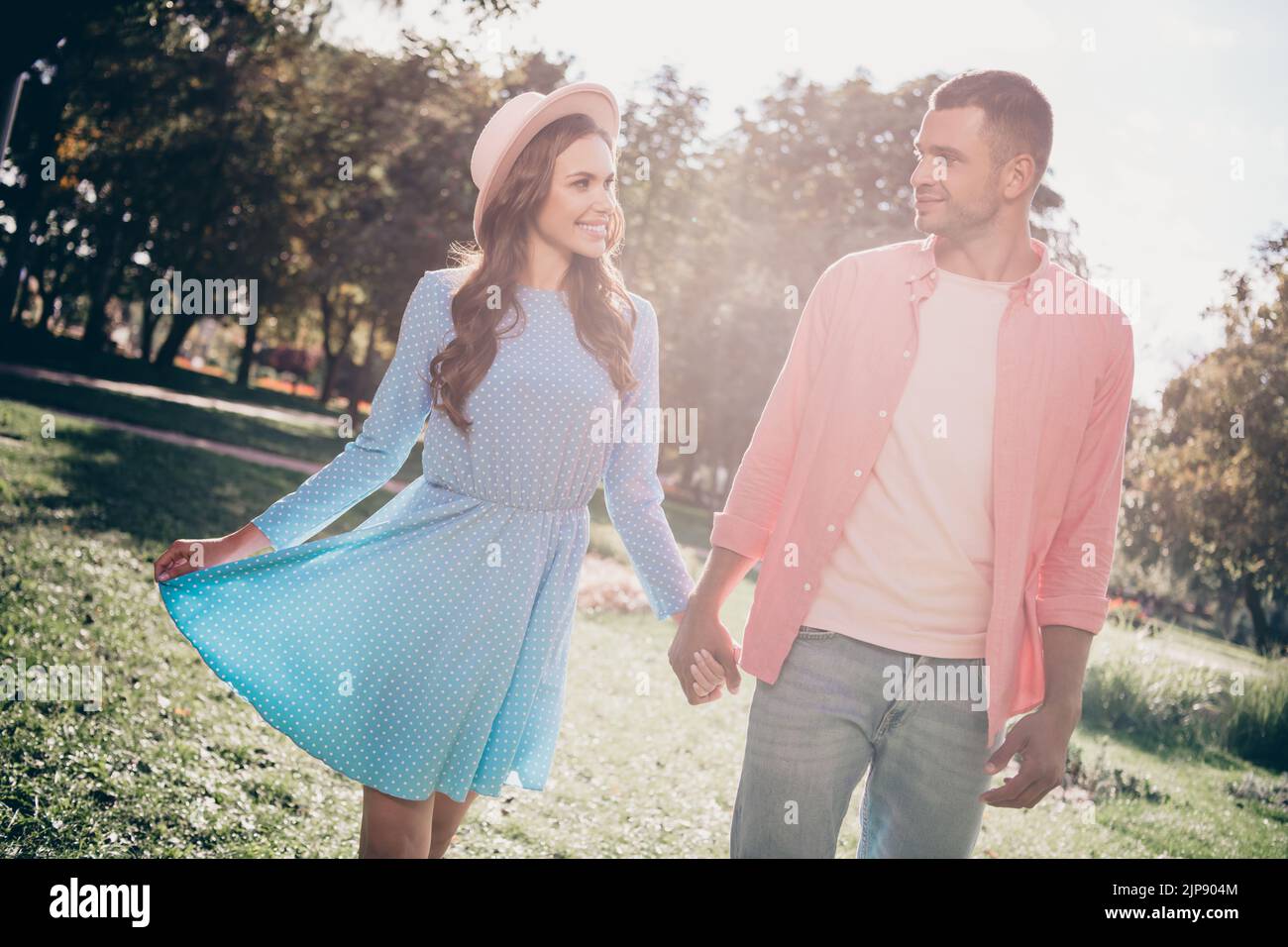 Photo of shiny charming two people together wear casual outfits walking ...