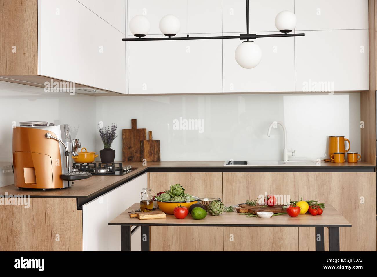 Modern loft-style kitchen ready for cooking, copy space Stock Photo - Alamy