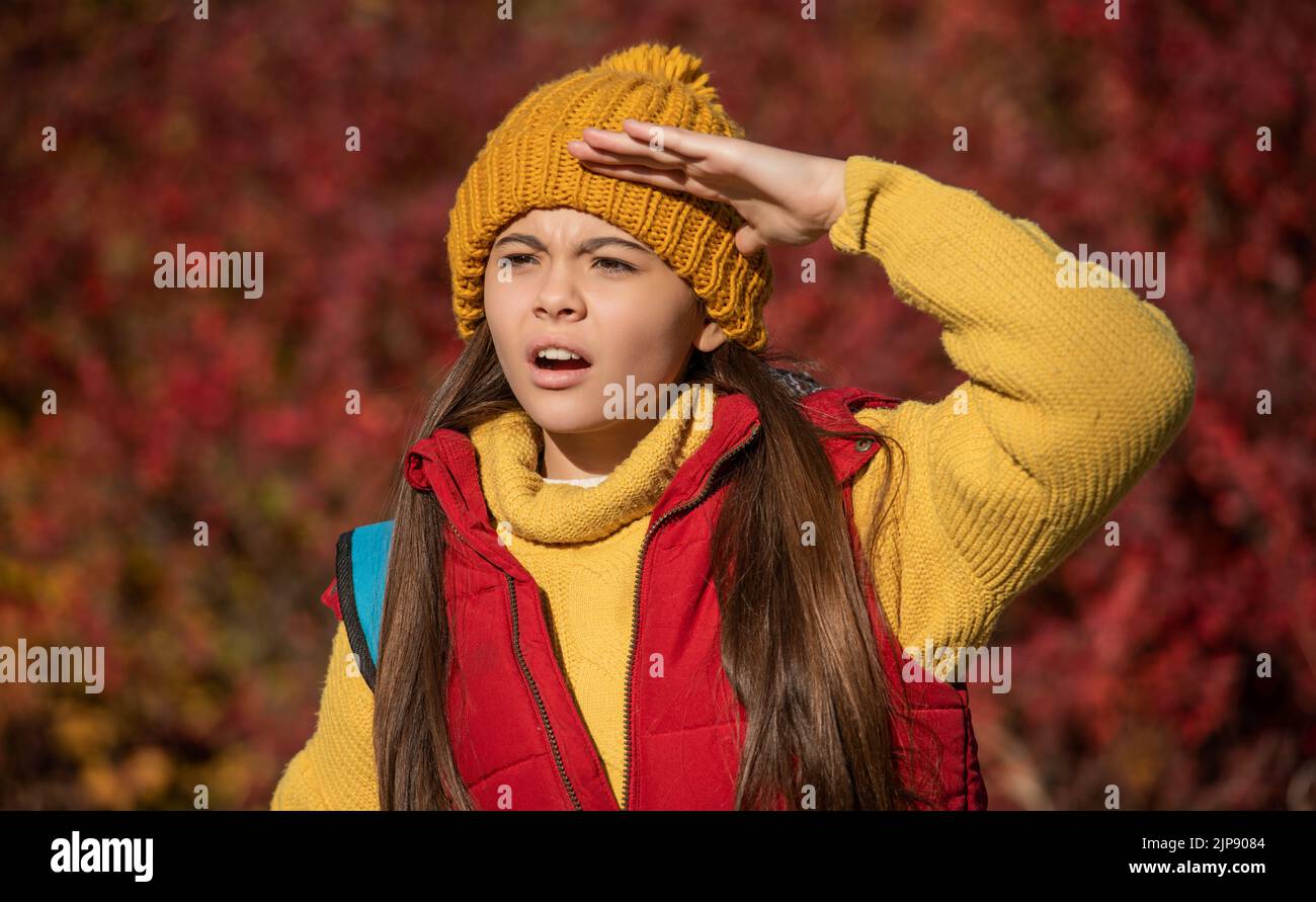 curious teen girl at school time outdoor in autumn season Stock Photo ...