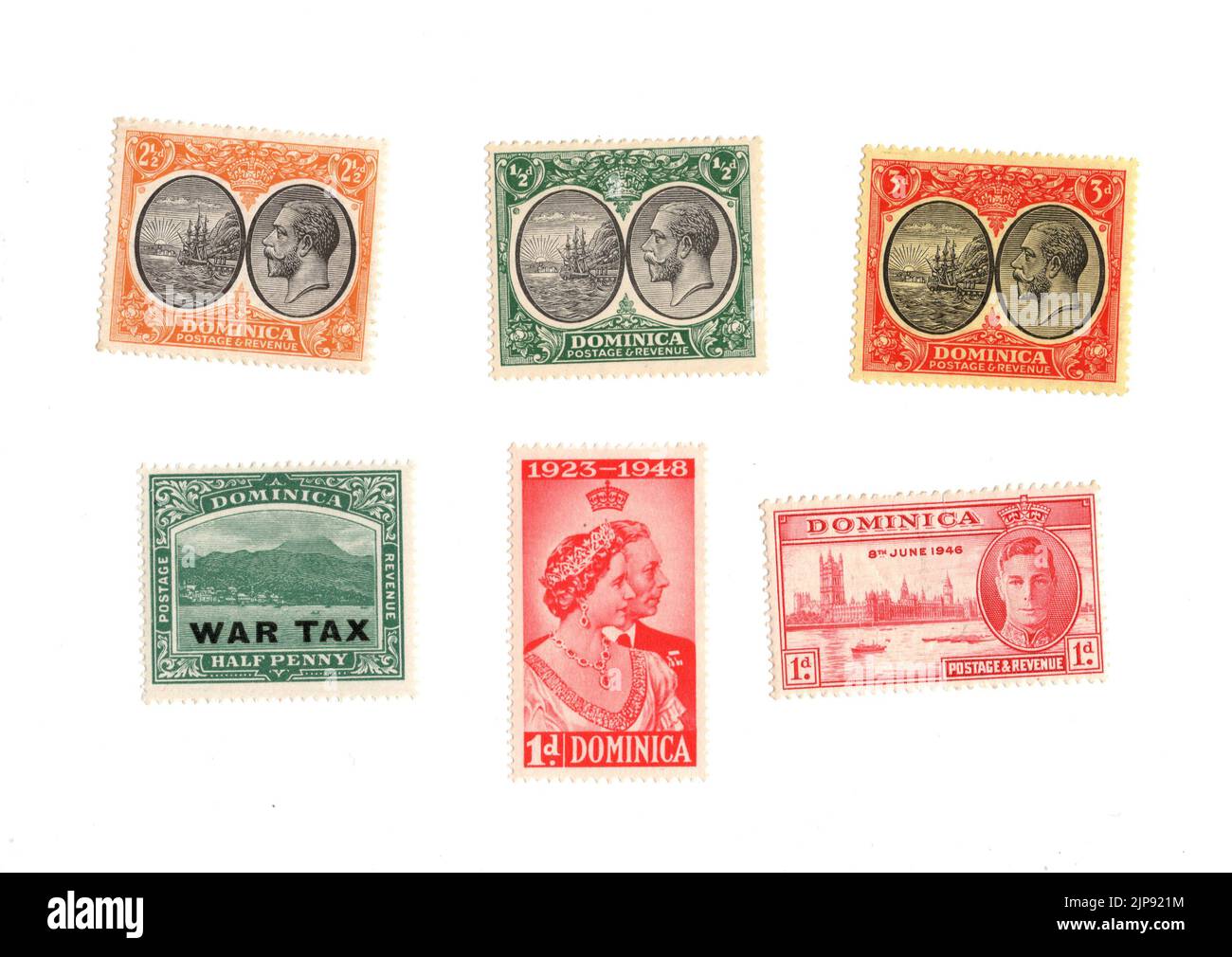 A selection of old mint postage stamps from Dominica on a white ... A selection of old mint postage stamps from Dominica on a white ...