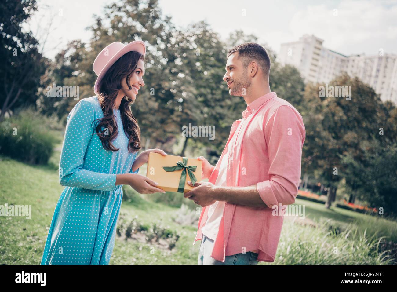 Photo of sweet shiny two people together wear casual outfits presenting ...