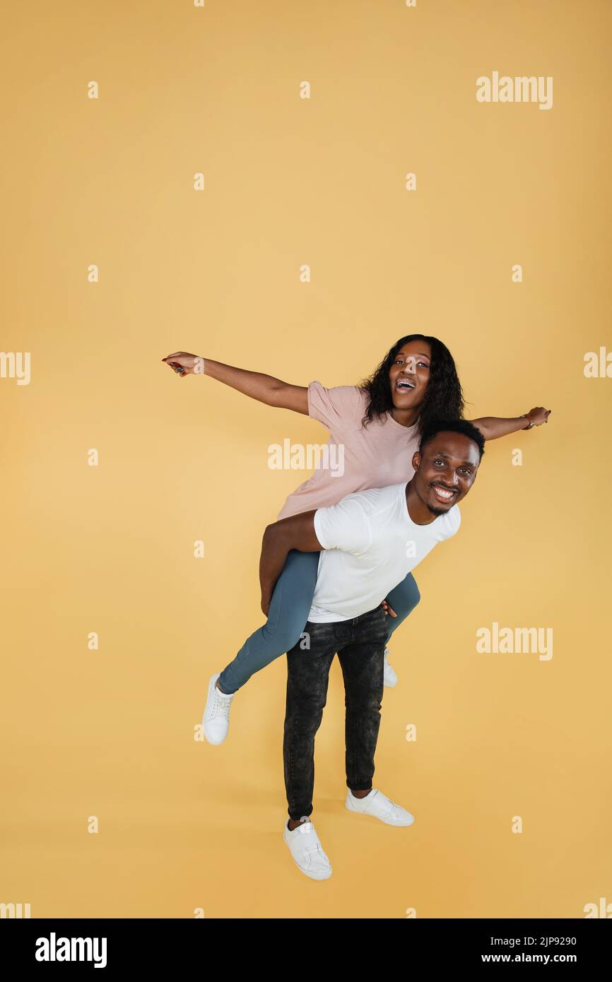 I will show you sky. Portrait of positive cheerful african american man ...