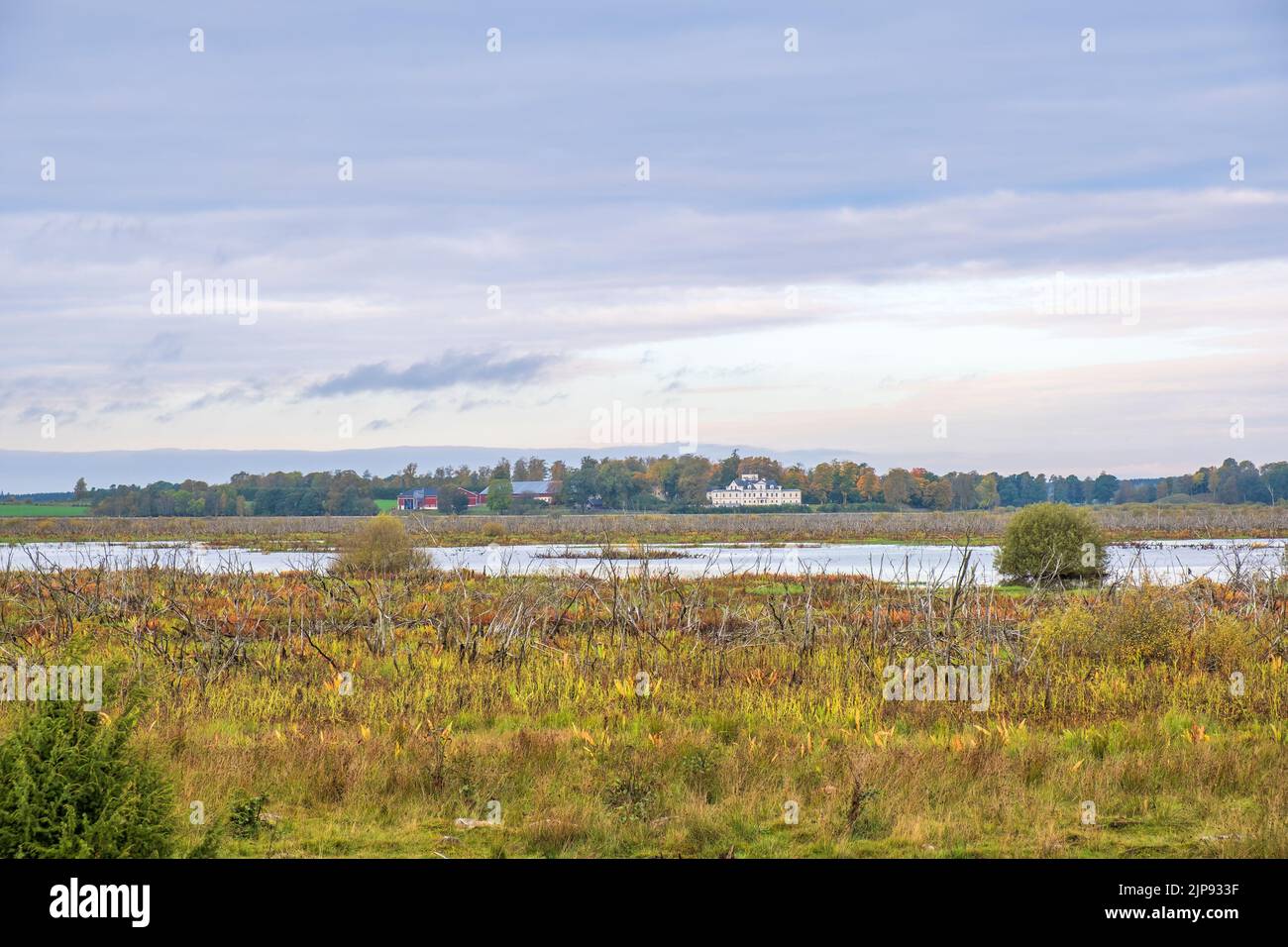 Landscape view at a wetland with a castle Stock Photo - Alamy