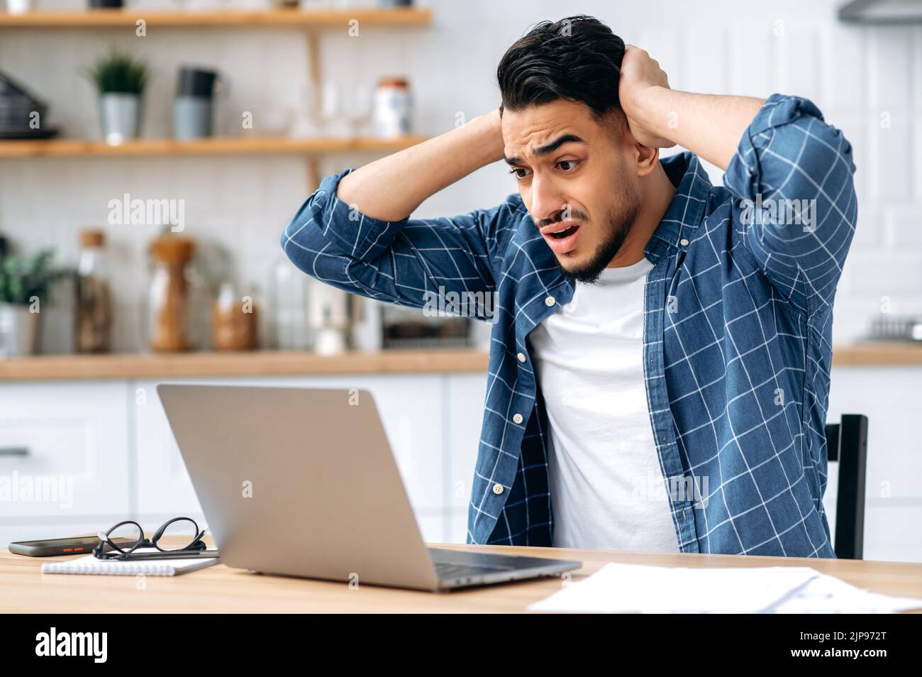 Irritated angry stressed arabian or indian man, sit at desk in the ...