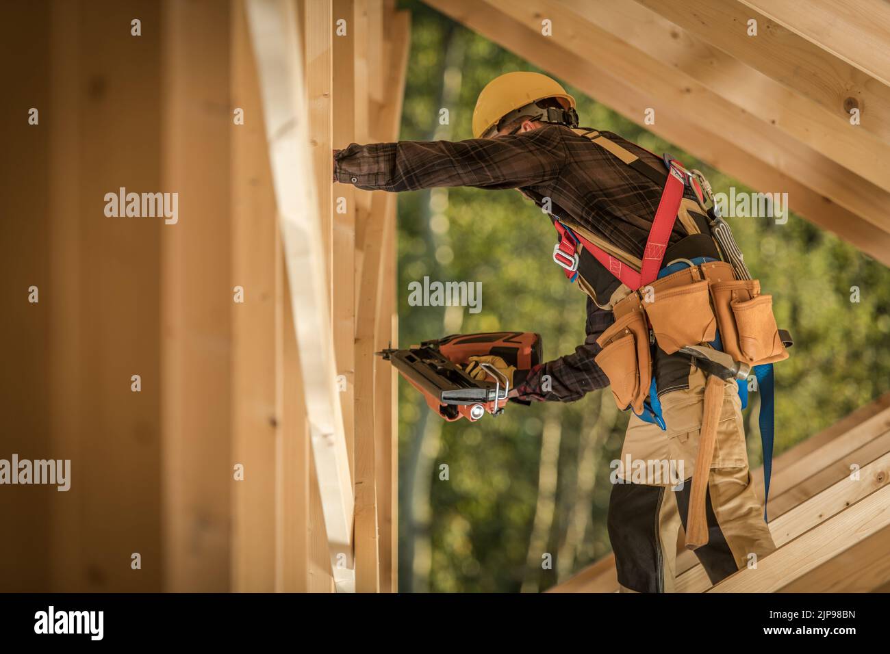 Caucasian Male Worker Wearing Safety Harness and Hard Hat on the ...