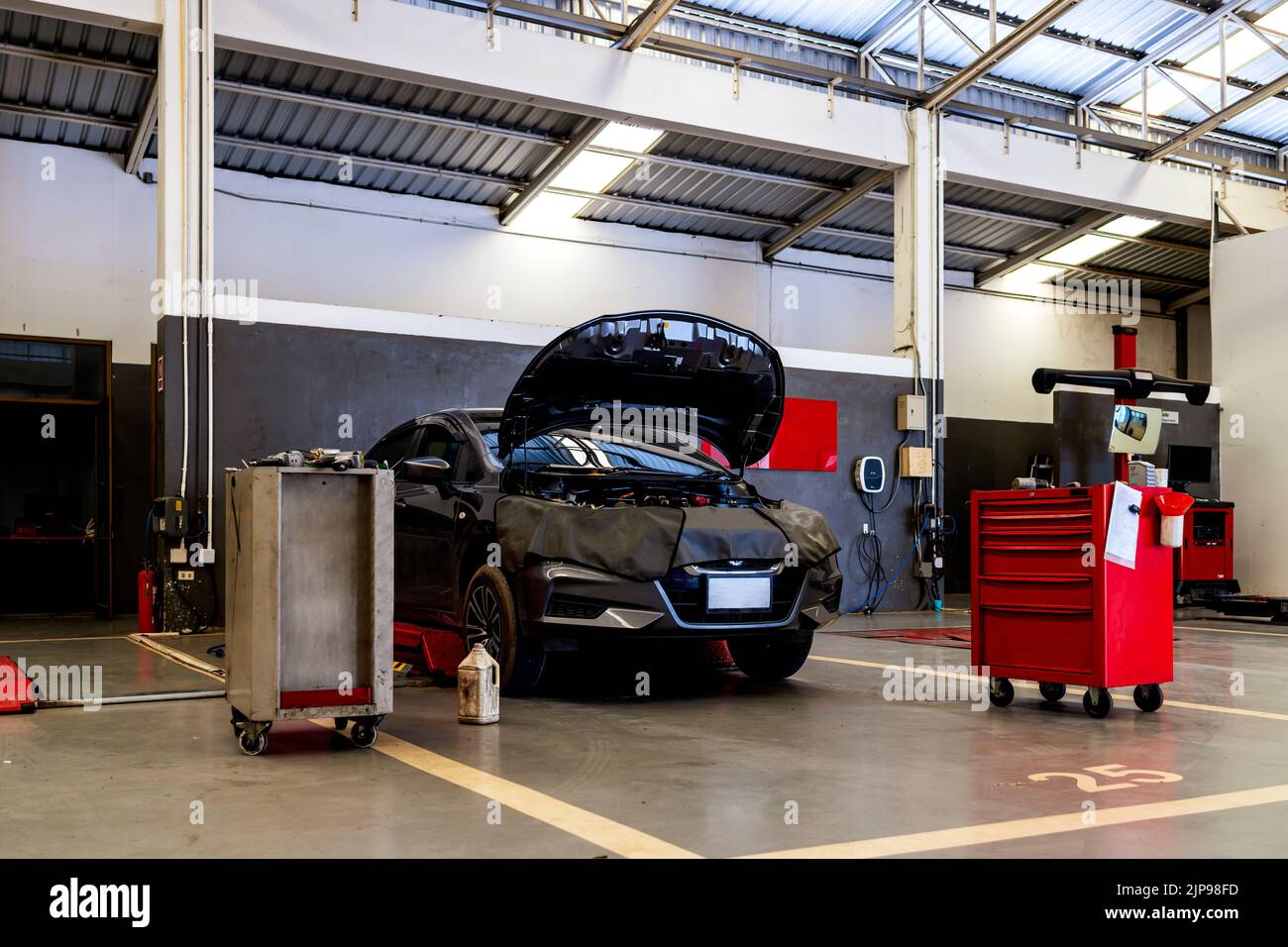 car in automobile repair service center with soft-focus and over light ...