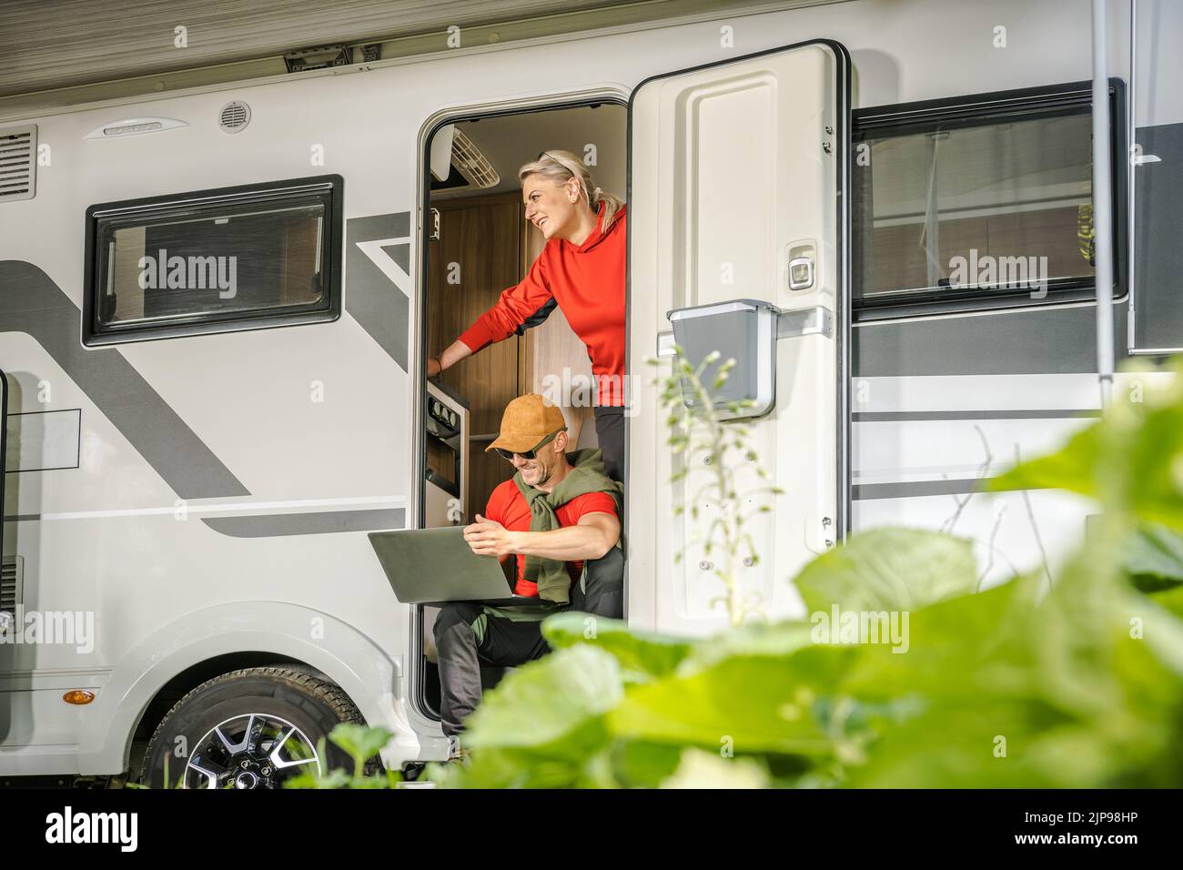 Happy Caucasian Family in Their Motorhome Doing Their Daily Activities ...
