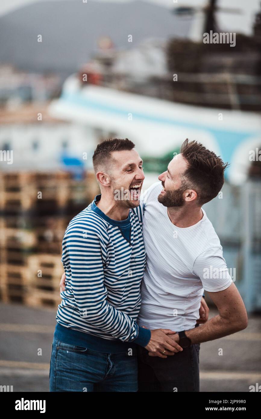 Gay couple laughing with baby hi-res stock photography and images - Alamy
