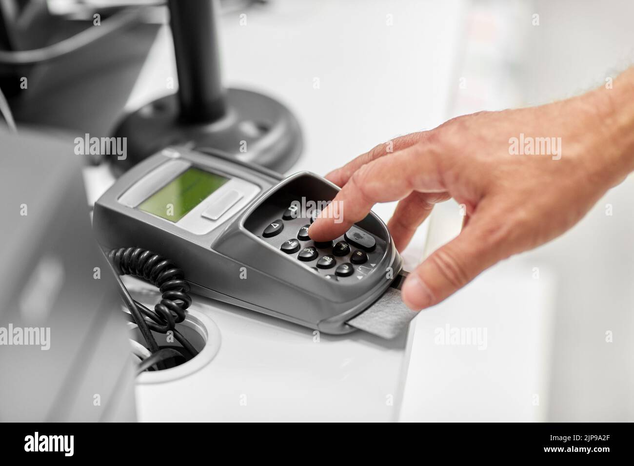 close up of hand with credit card in card-reader Stock Photo - Alamy