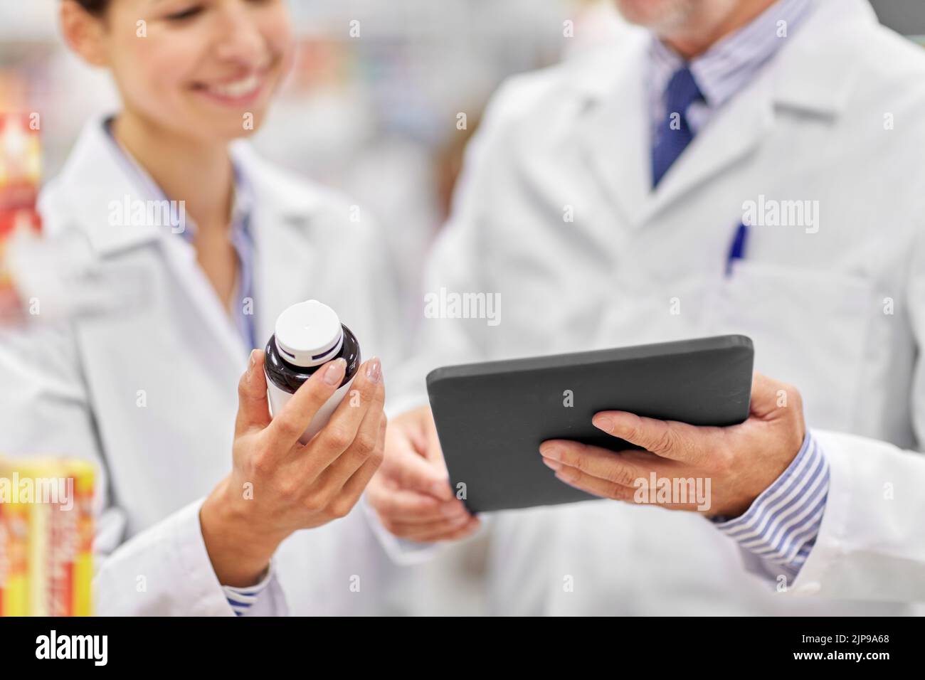 pharmacists with tablet pc and medicine Stock Photo - Alamy