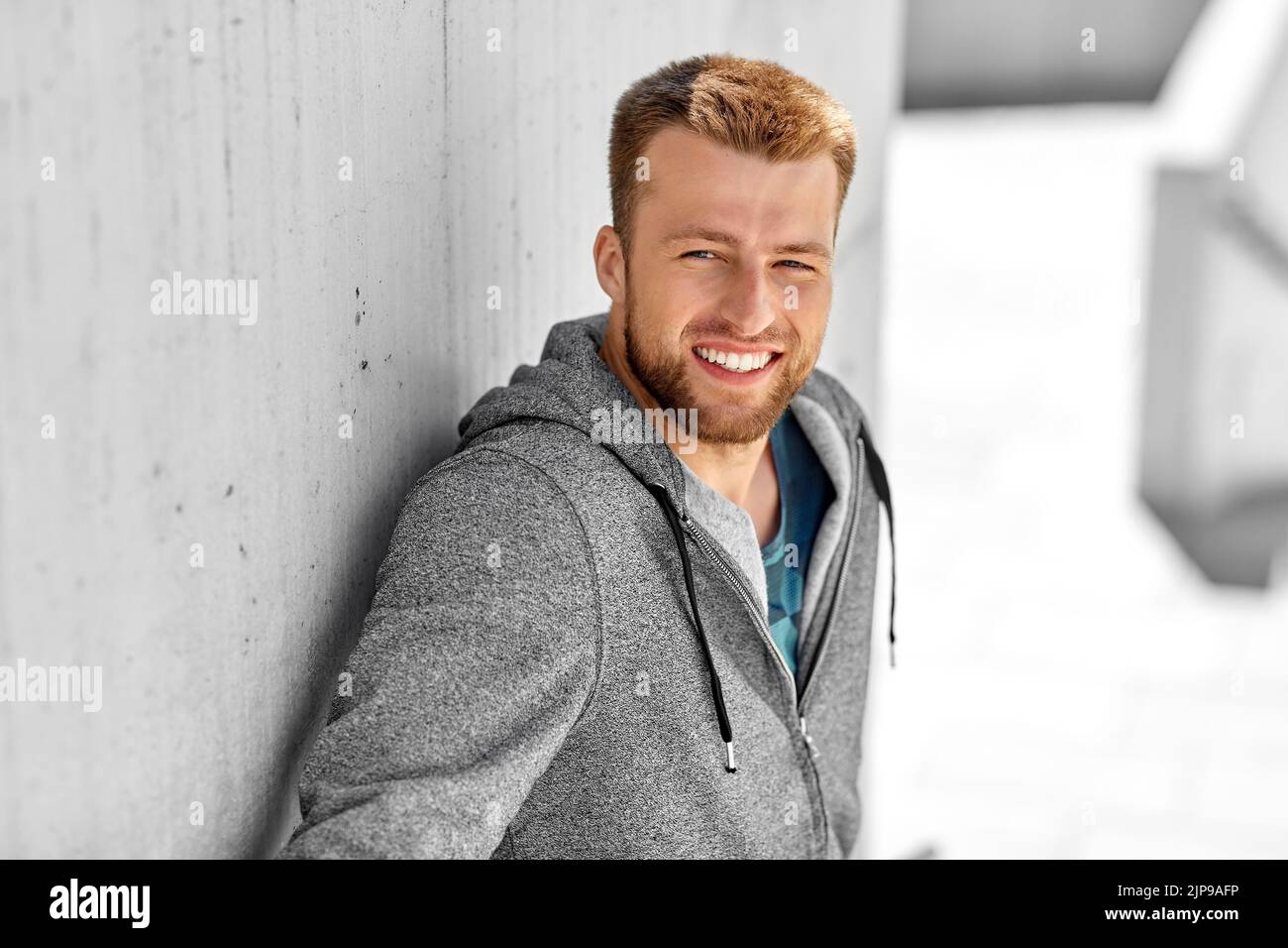 portrait of happy smiling young man outdoors Stock Photo - Alamy