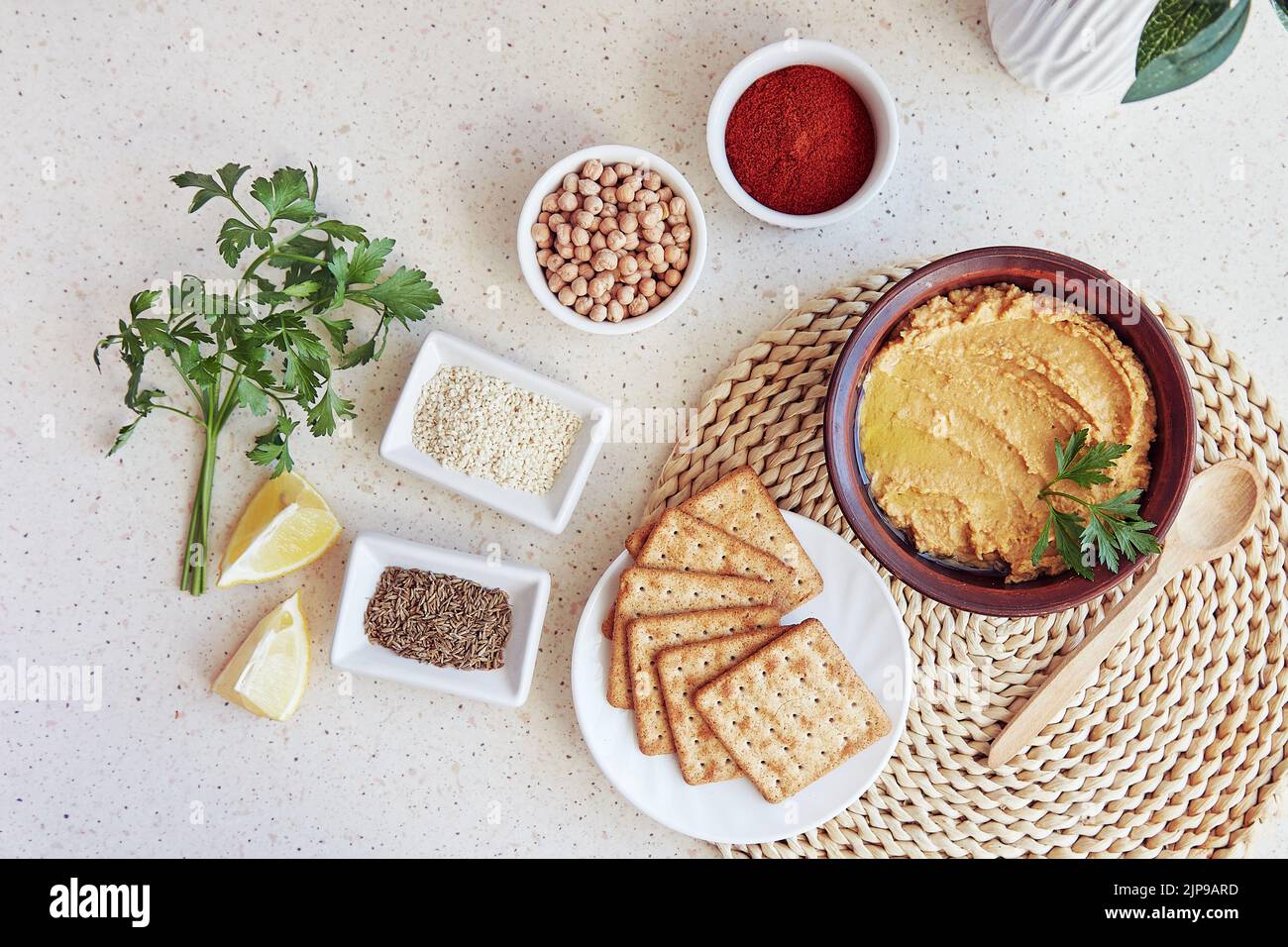 Healthy vegetarian appetizer. Traditional hummus with grain cookies ...