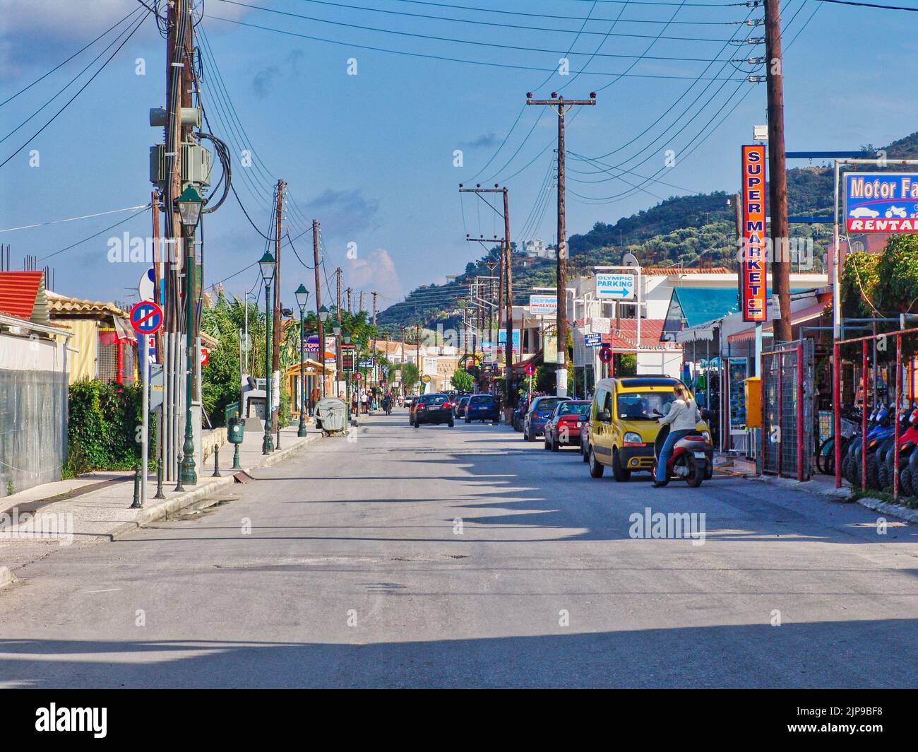 A beautiful view of a road with cars and markets in a village in ...