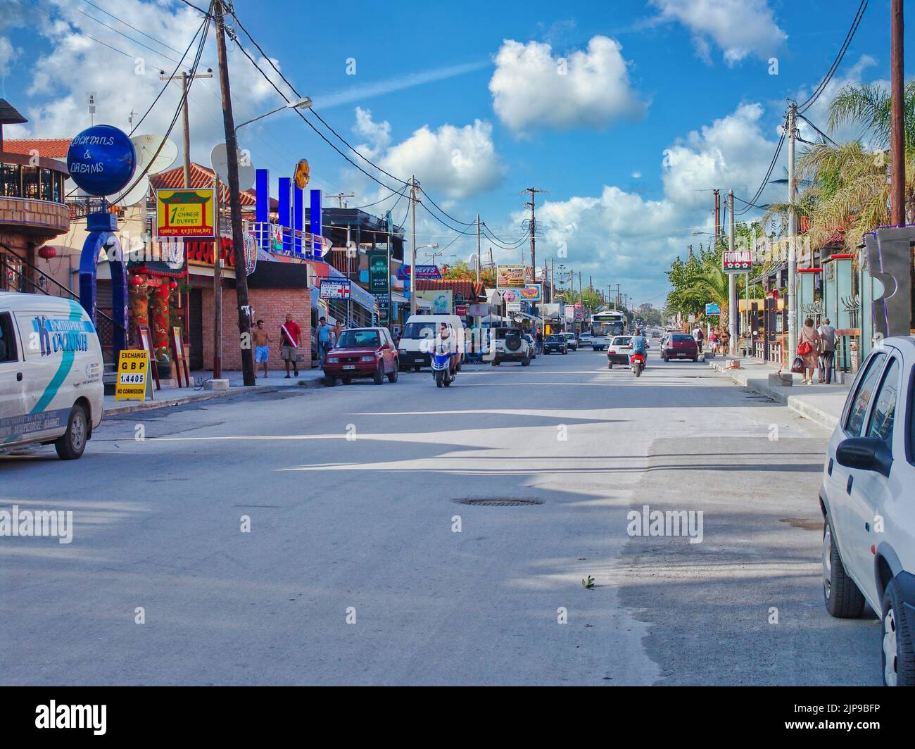 A beautiful view of a road with cars and markets in a village in ...