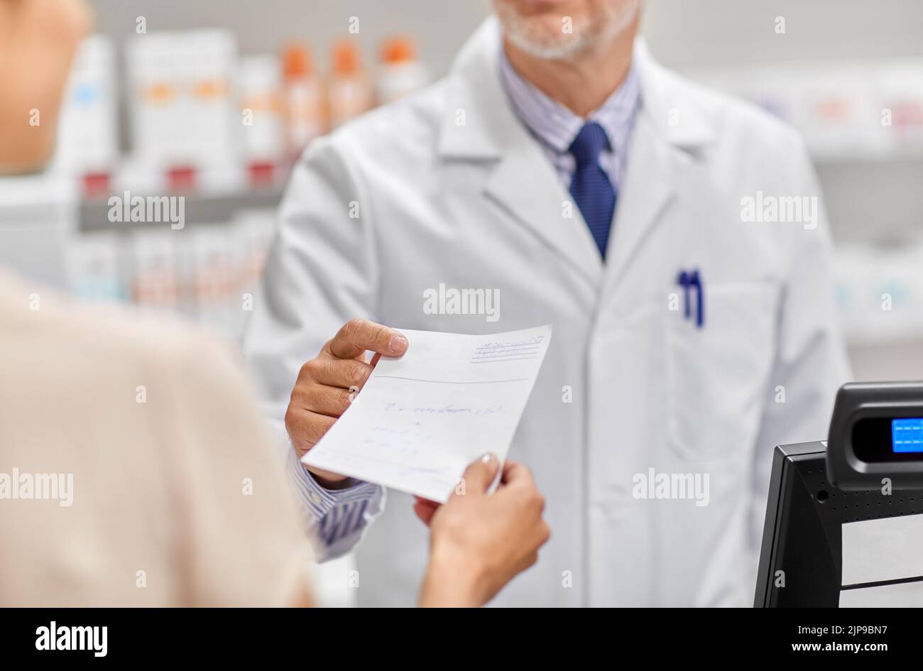 pharmacist and customer with medical prescription Stock Photo - Alamy